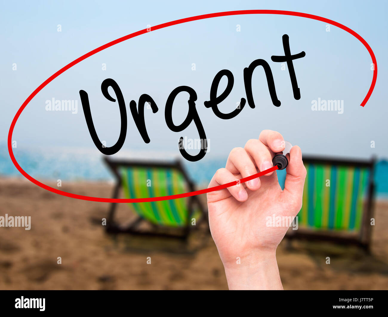 Man Hand writing Urgent with black marker on visual screen. Isolated on ...