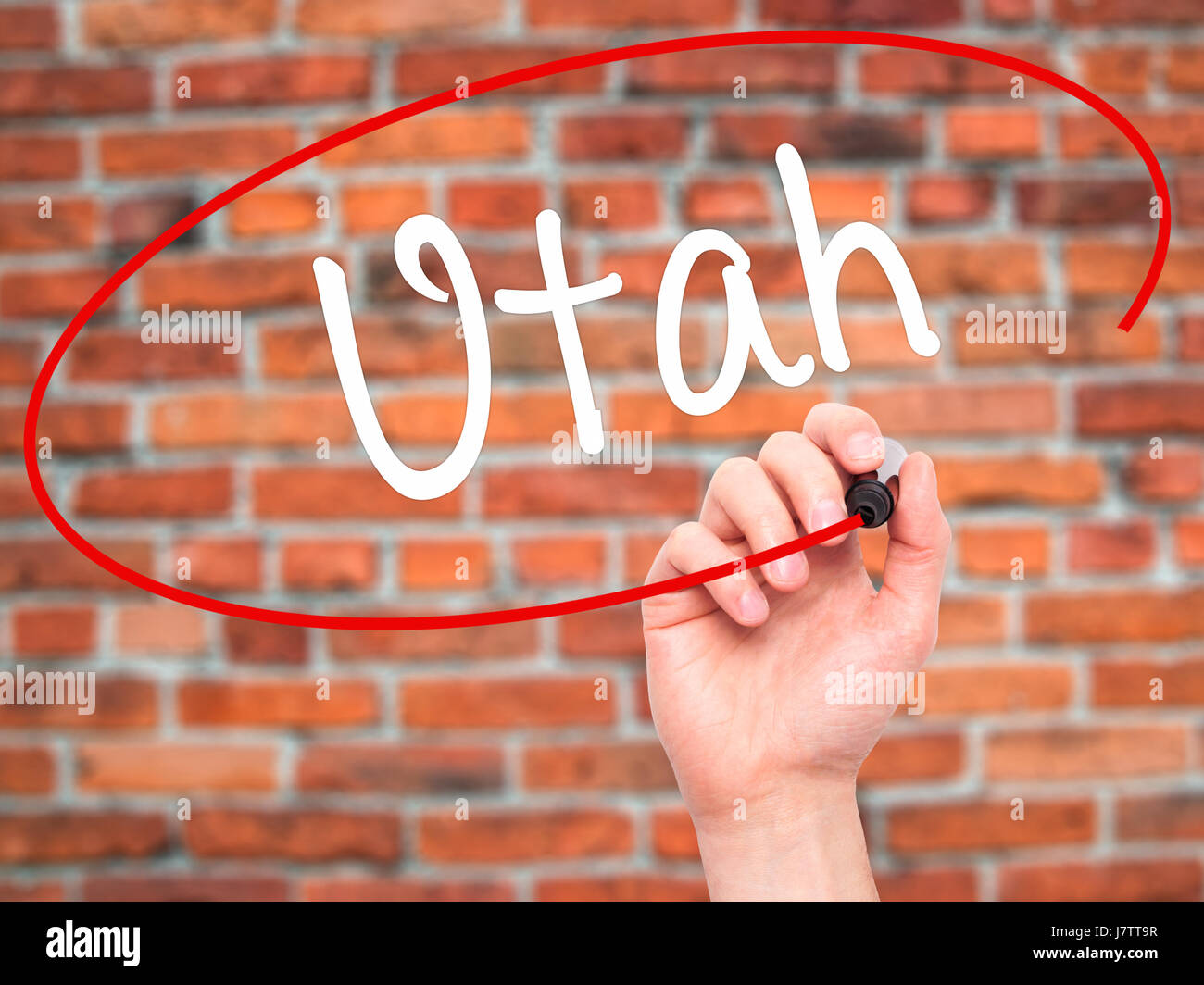 Man Hand writing Utah with black marker on visual screen. Isolated on ...