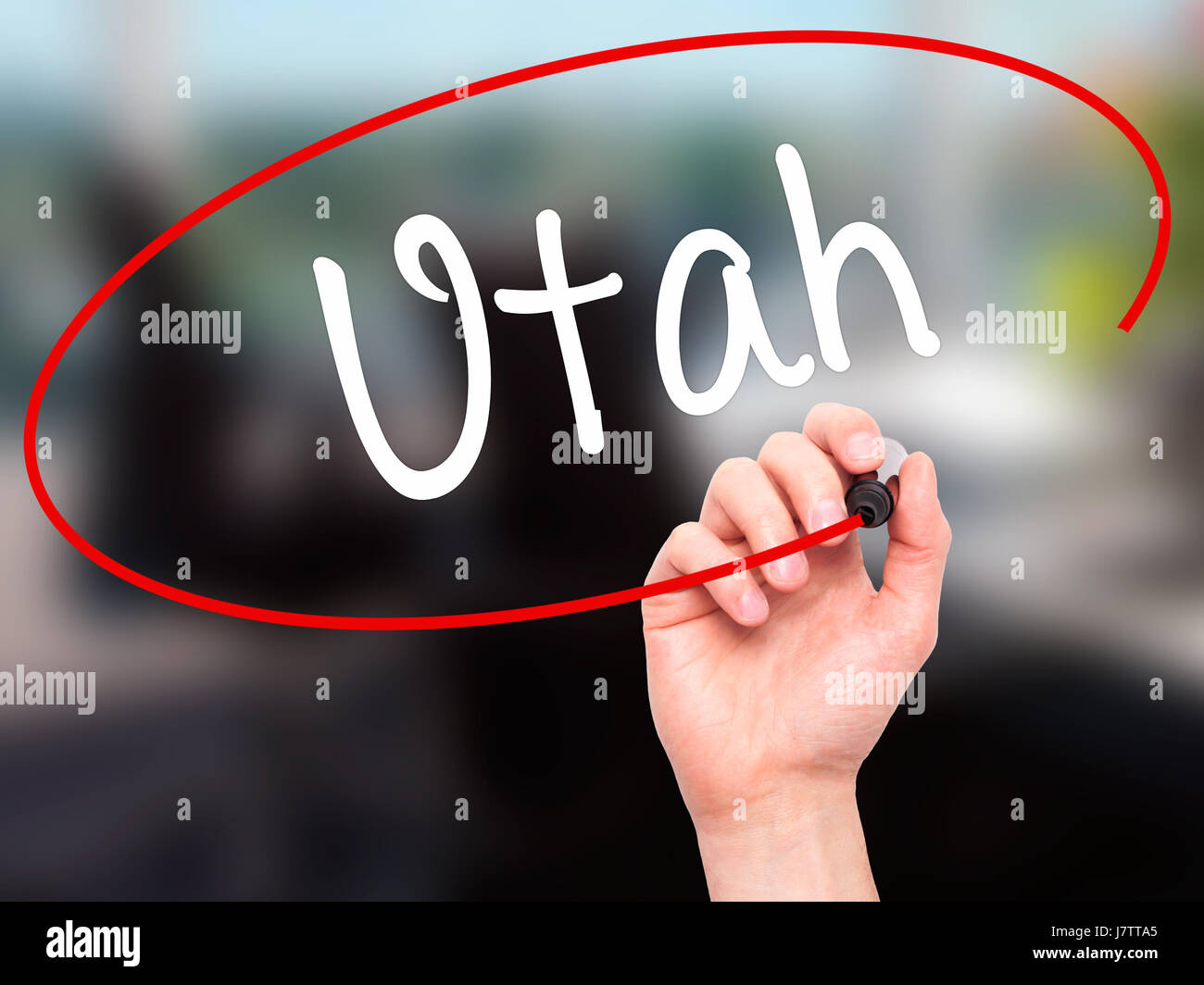 Man Hand writing Utah with black marker on visual screen. Isolated on ...