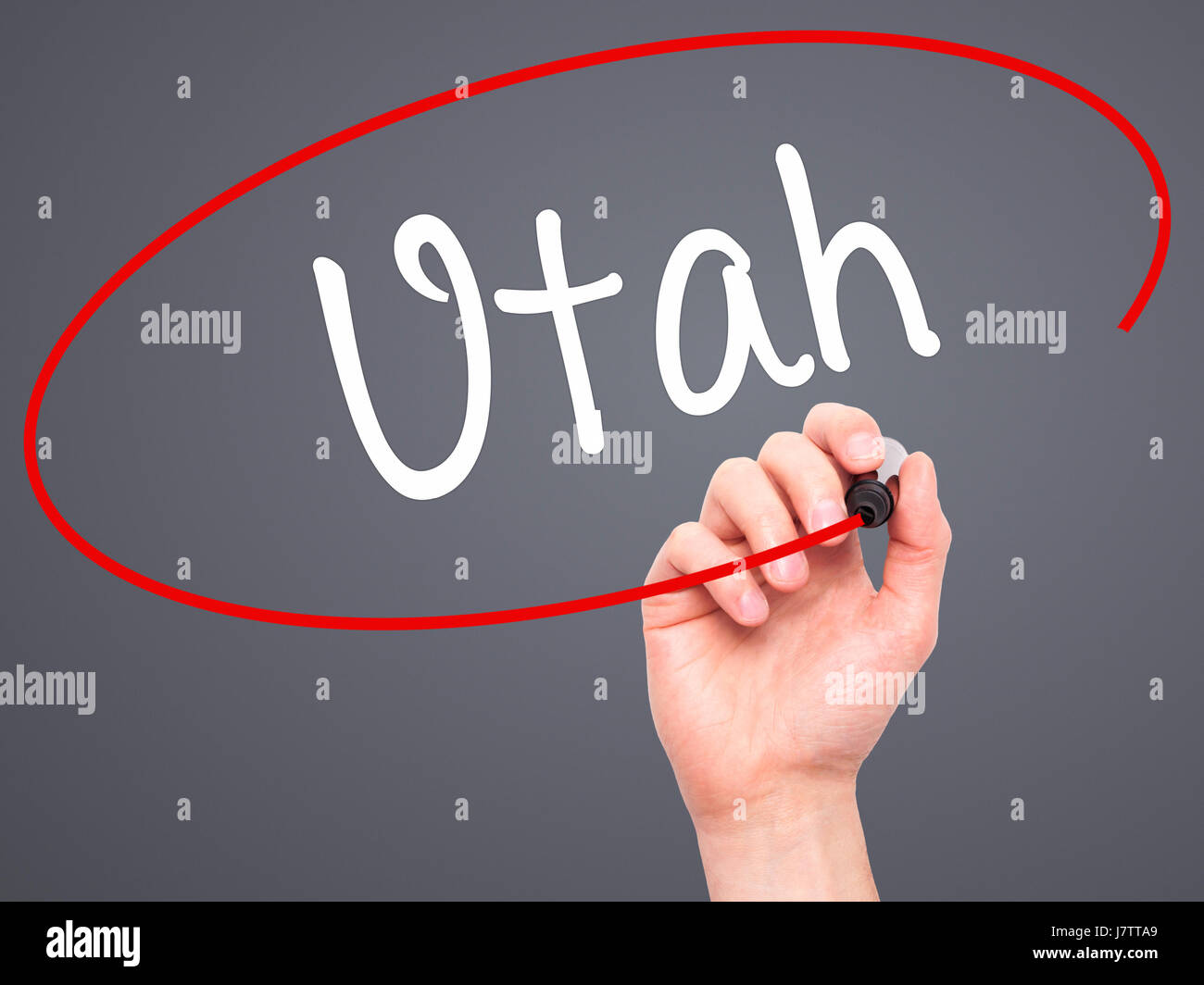 Man Hand writing Utah with black marker on visual screen. Isolated on ...