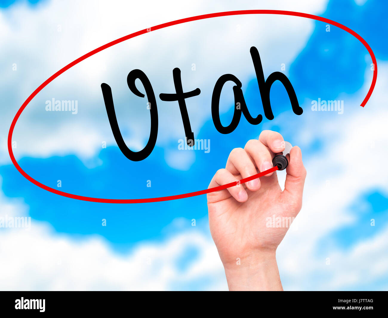 Man Hand writing Utah with black marker on visual screen. Isolated on ...