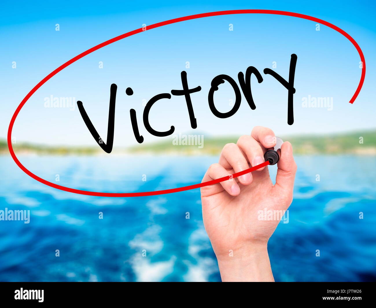 Man Hand writing Victory with black marker on visual screen. Isolated ...