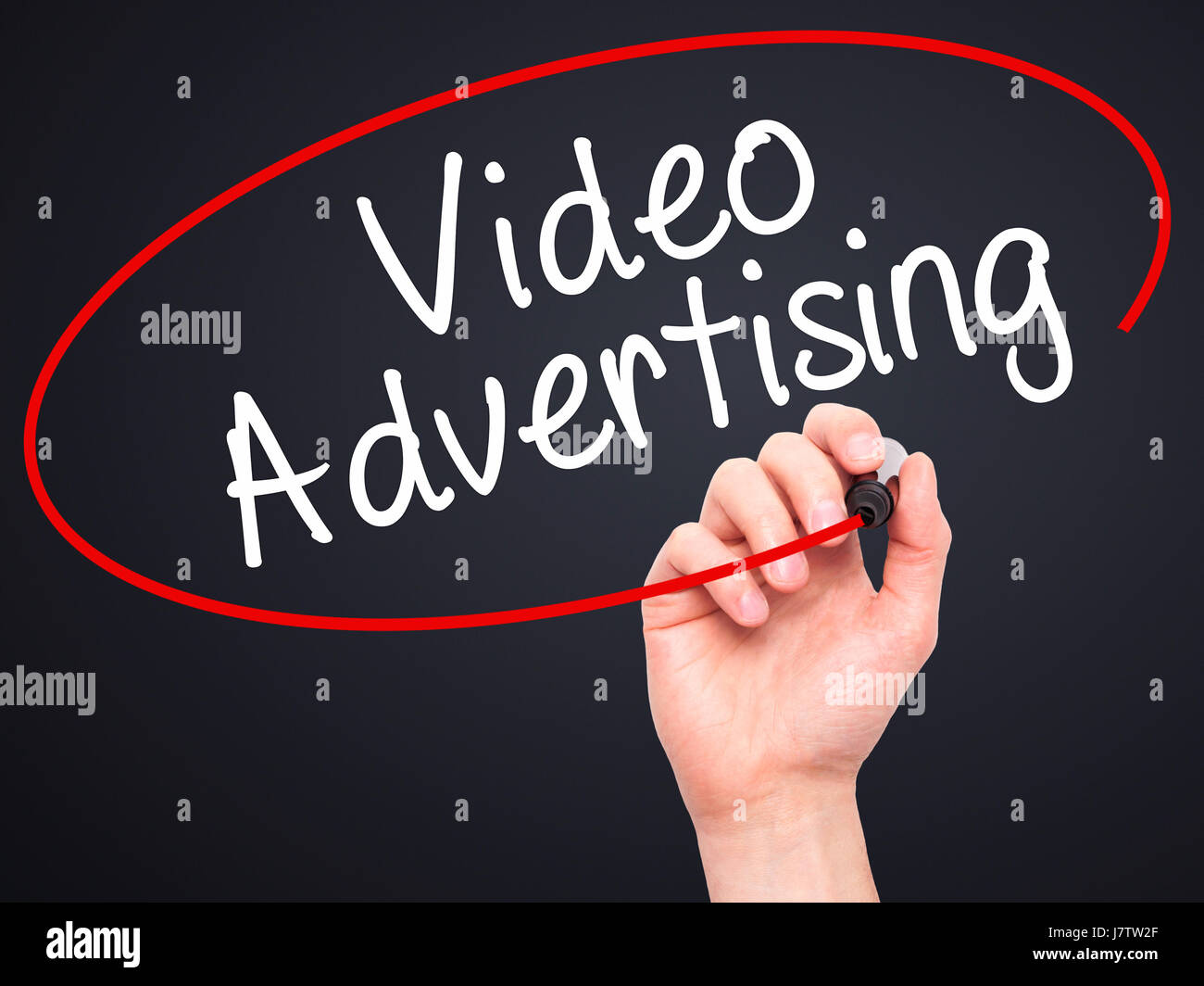 Man Hand writing Video Advertising with black marker on visual screen ...