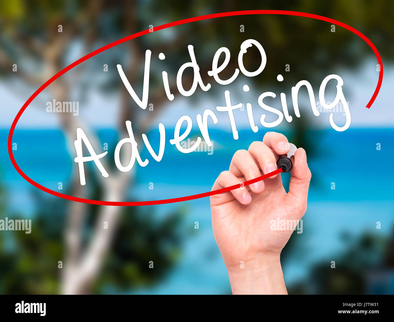 Man Hand writing Video Advertising with black marker on visual screen ...
