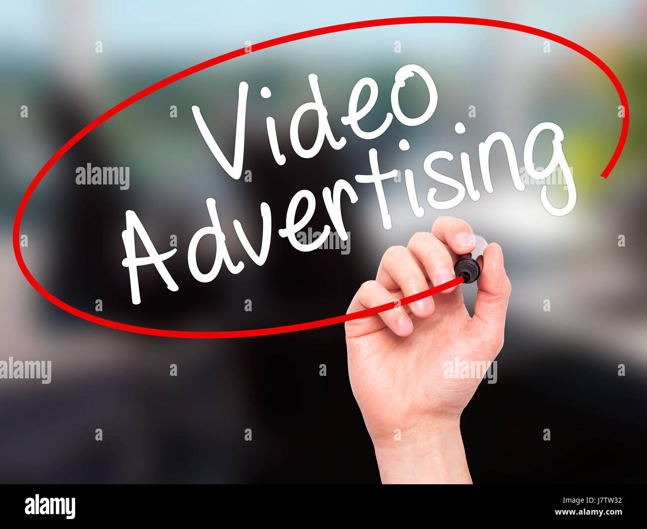 Man Hand writing Video Advertising with black marker on visual screen ...