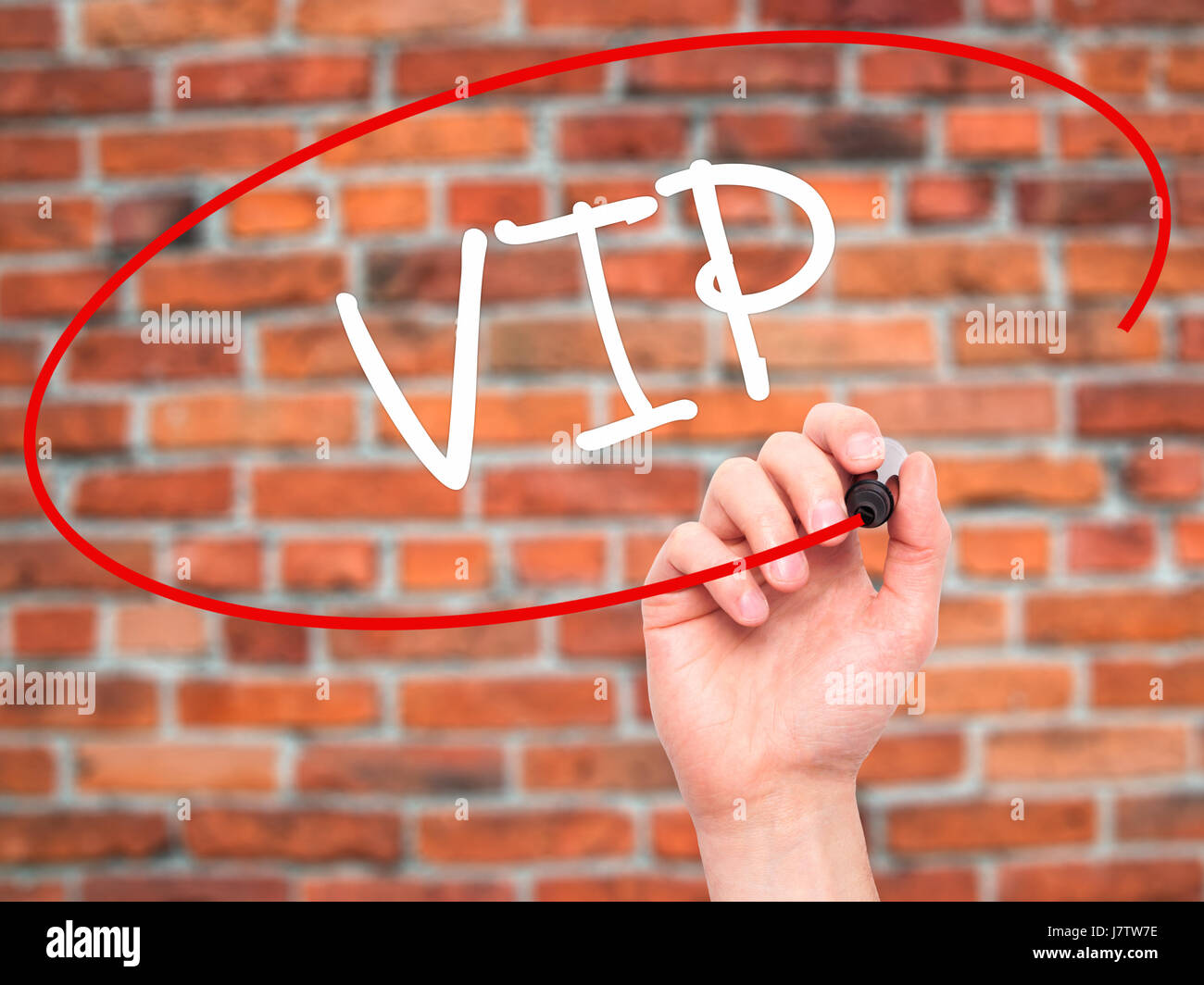 Man Hand writing VIP with black marker on visual screen. Isolated on ...