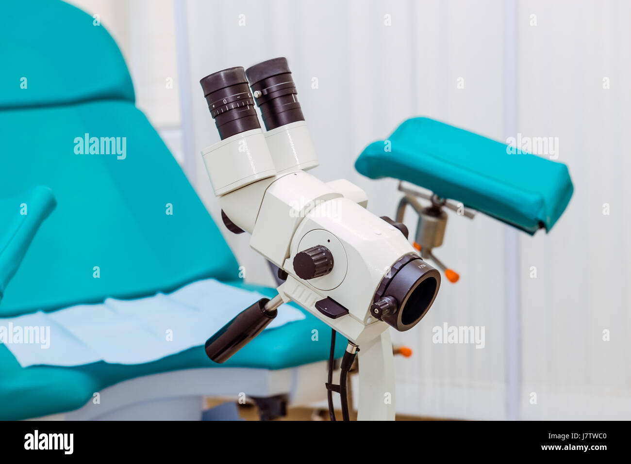 Colposcope and chair in the gynecology office. Selective focus Stock ...
