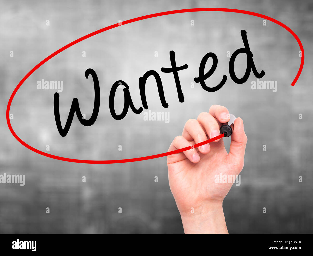 Man Hand writing Wanted with black marker on visual screen. Isolated on ...