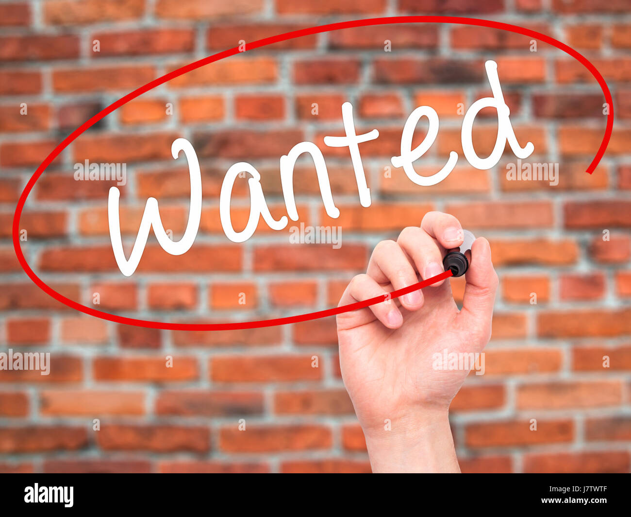 Man Hand writing Wanted with black marker on visual screen. Isolated on ...