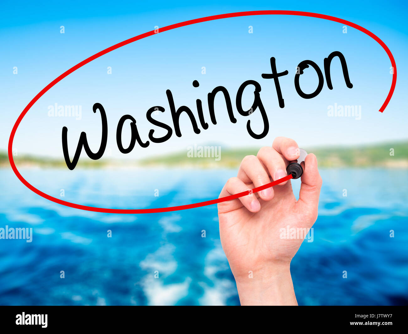 Man Hand writing Washington with black marker on visual screen ...