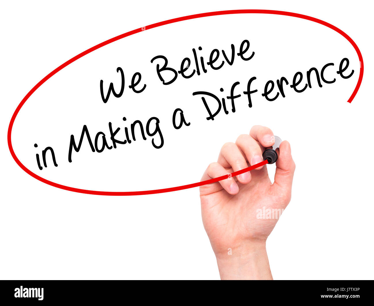 Man Hand writing We Believe in Making a Difference with black marker on ...