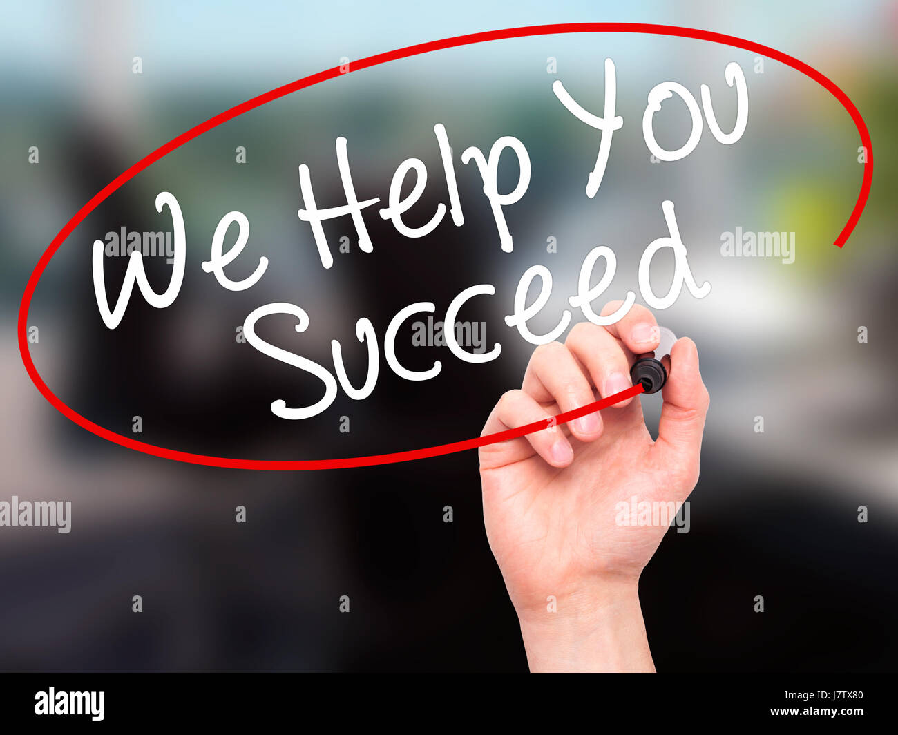 Man Hand writing We Help You Succeed with black marker on visual screen ...