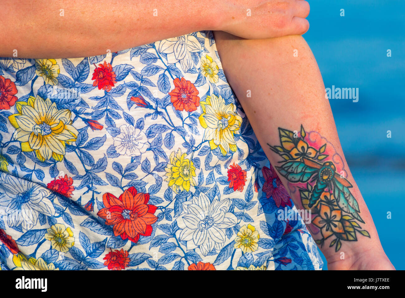 Woman with flower tattoo on arm hi-res stock photography and images - Alamy