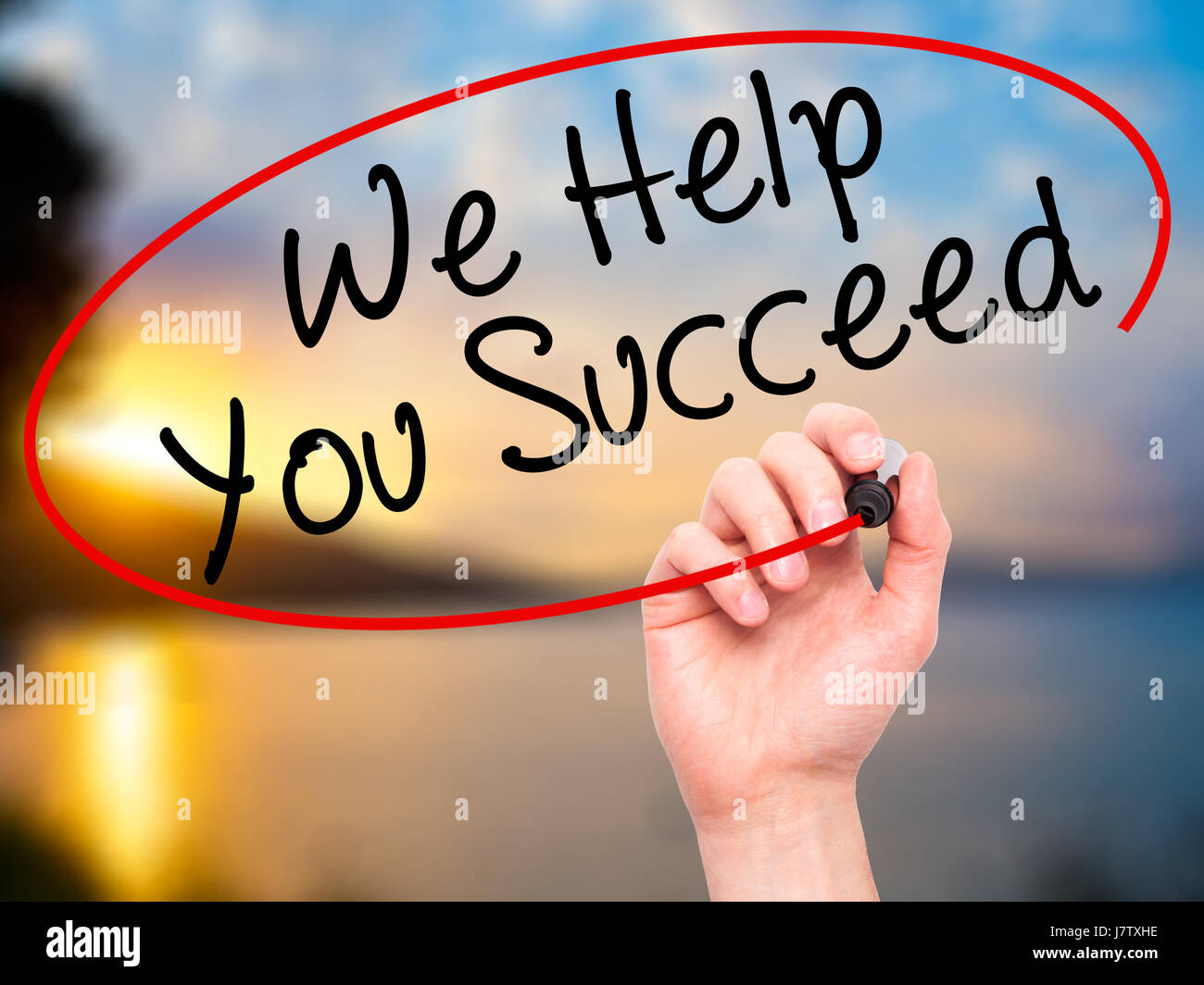 Man Hand writing We Help You Succeed with black marker on visual screen ...