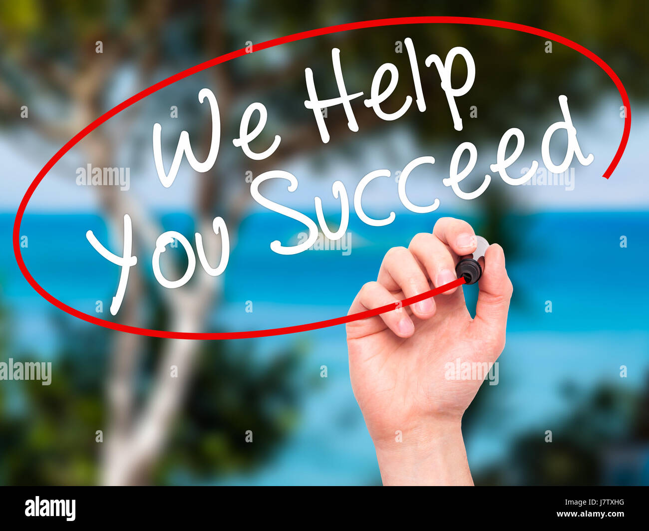Man Hand writing We Help You Succeed with black marker on visual screen ...