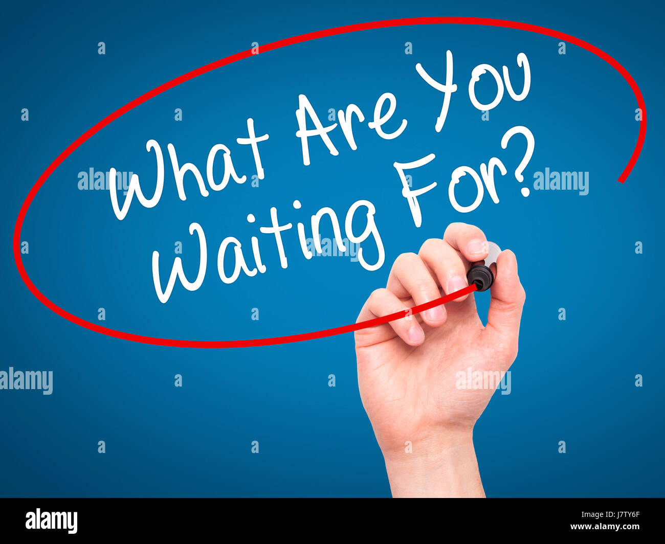 Man Hand writing What Are You Waiting For? with black marker on visual ...