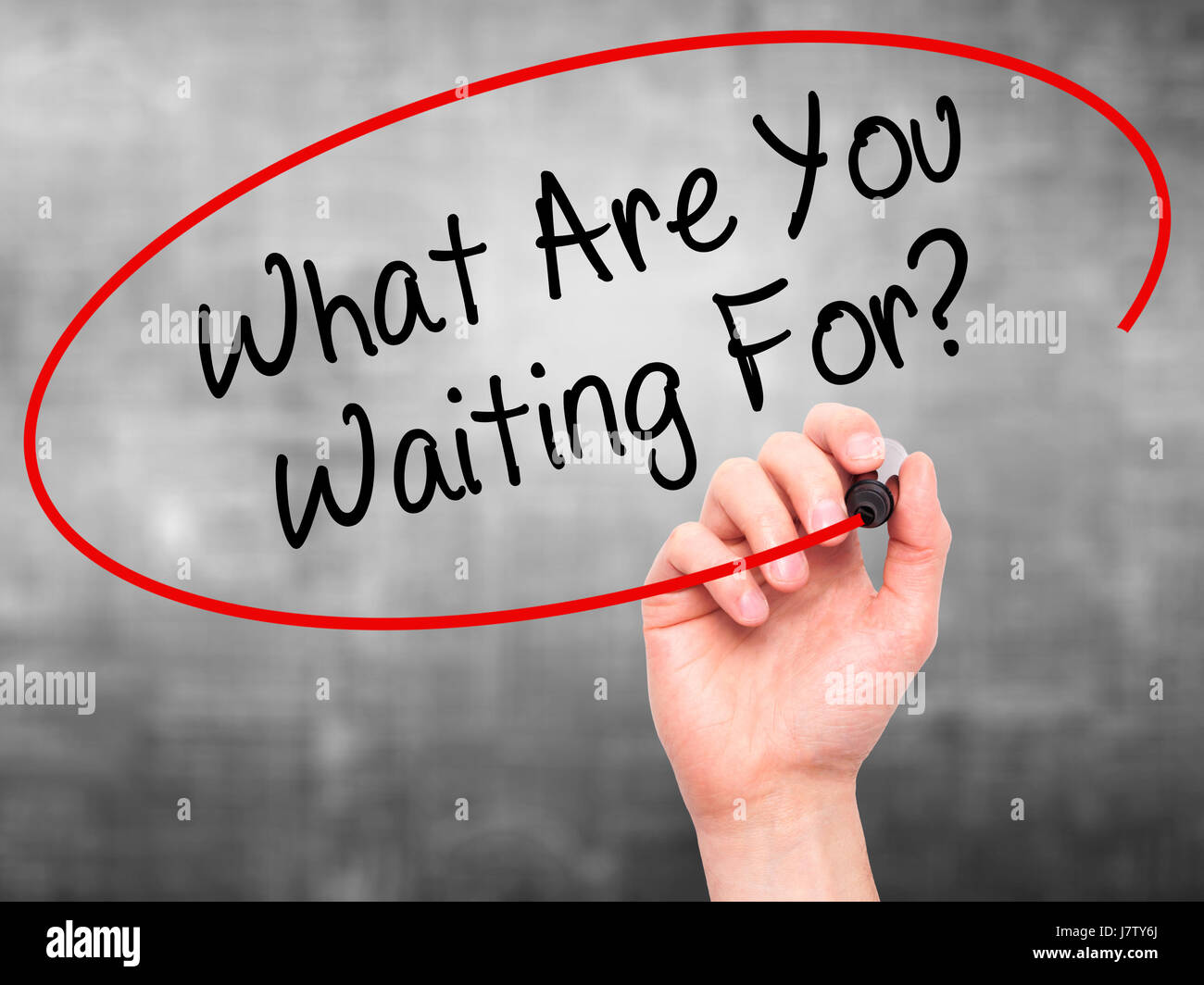 Man Hand writing What Are You Waiting For? with black marker on visual ...