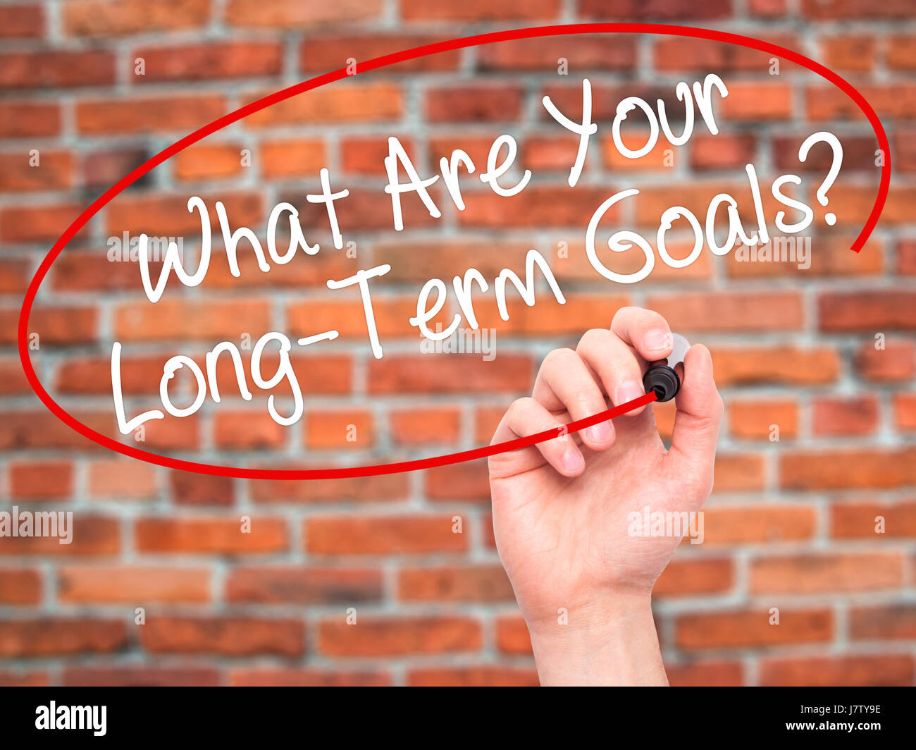 Man Hand writing What Are Your Long-Term Goals? with black marker on ...