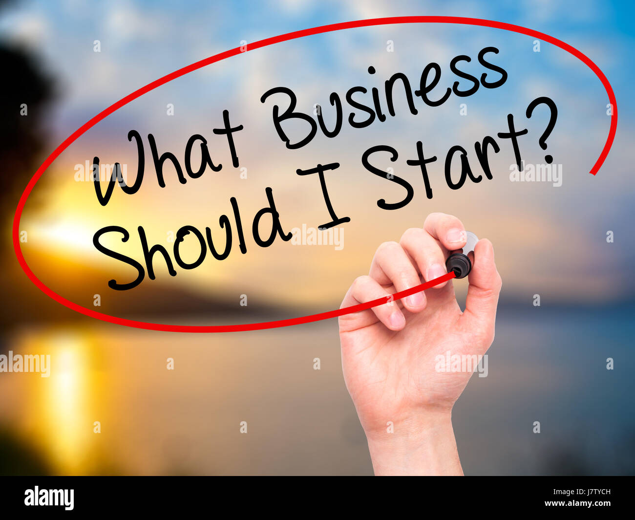 Man Hand writing What Business Should I Start? with black marker on ...