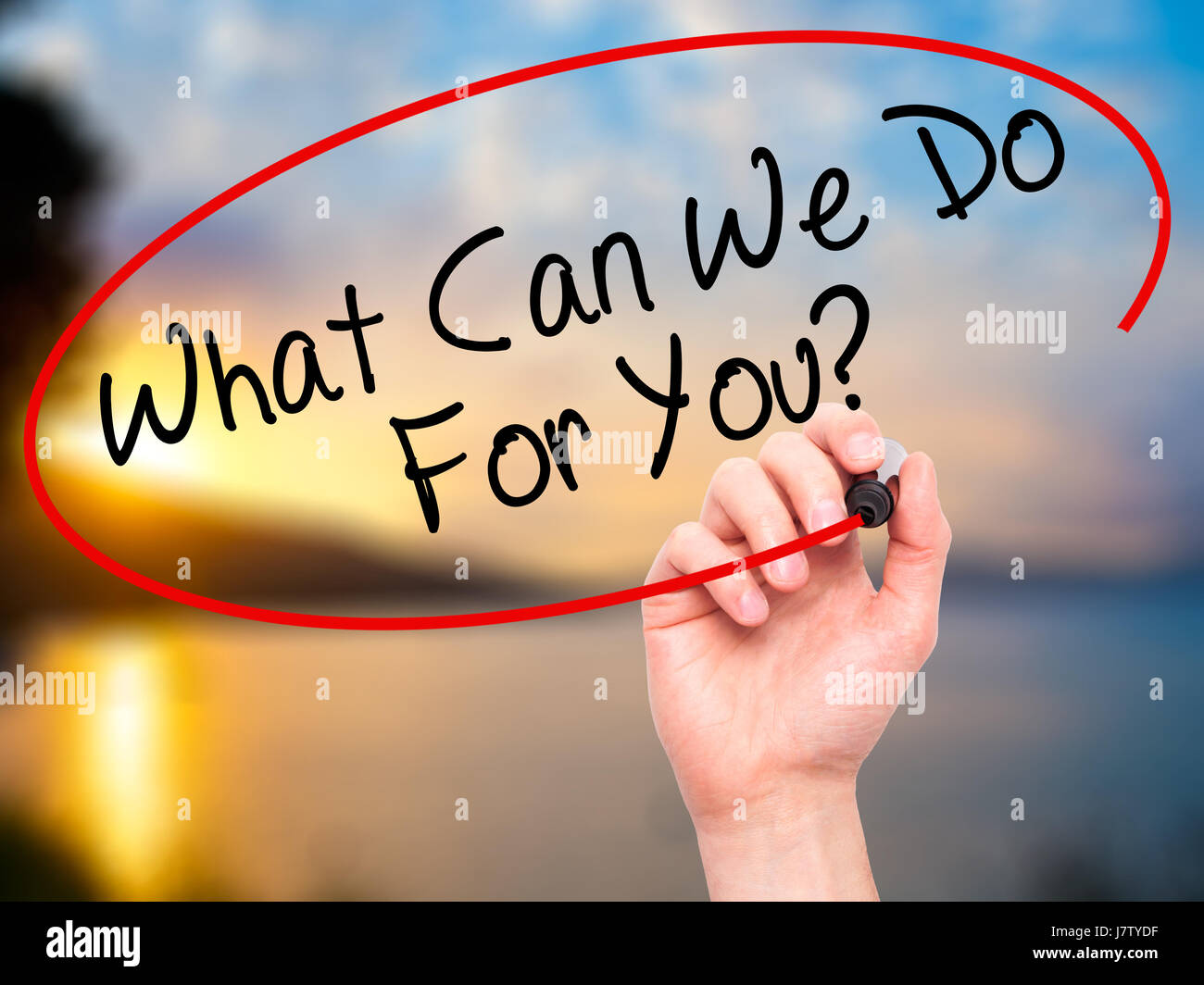 Man Hand writing What Can We Do For You? with black marker on visual ...