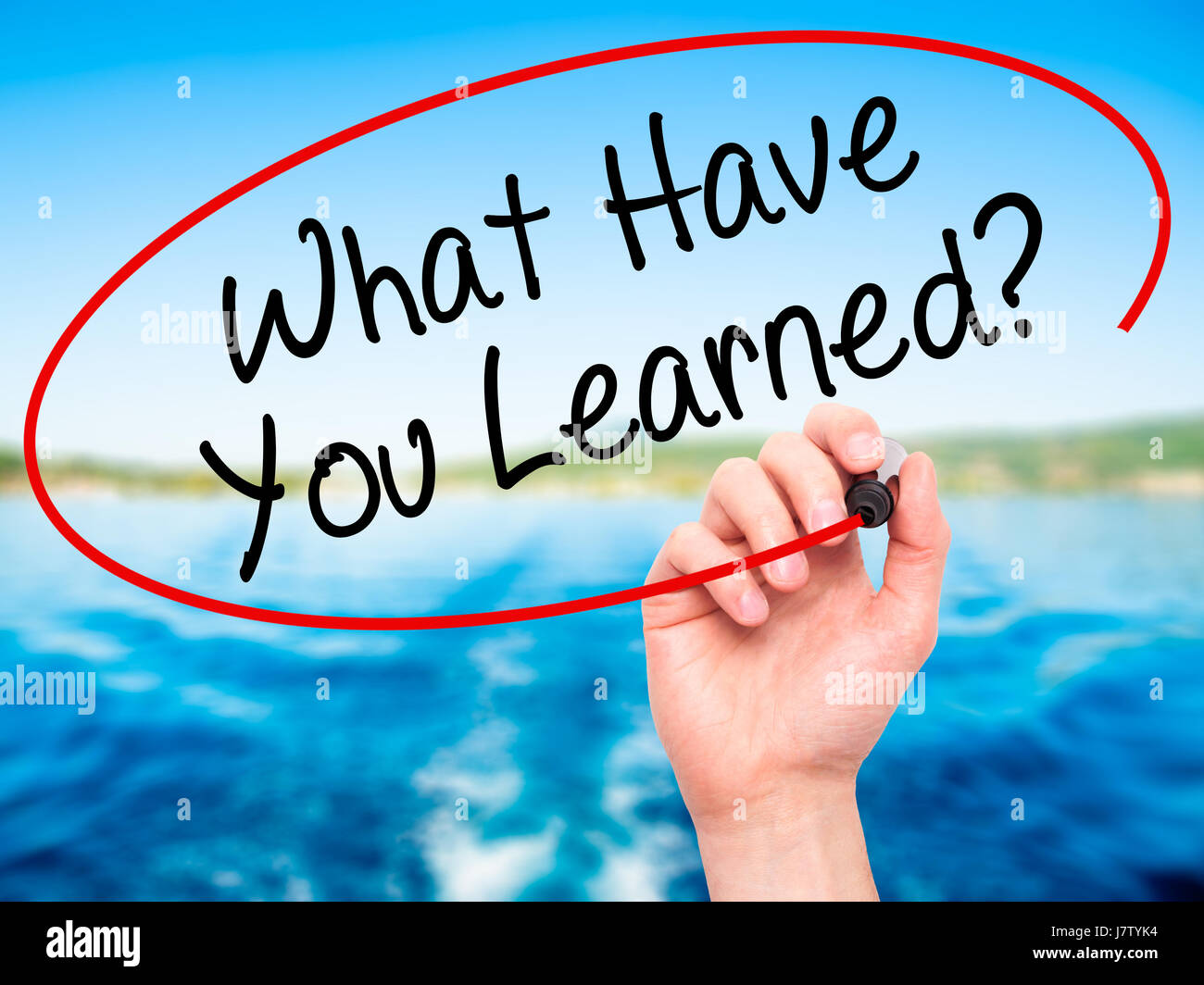 Man Hand writing What Have You Learned? with black marker on visual ...