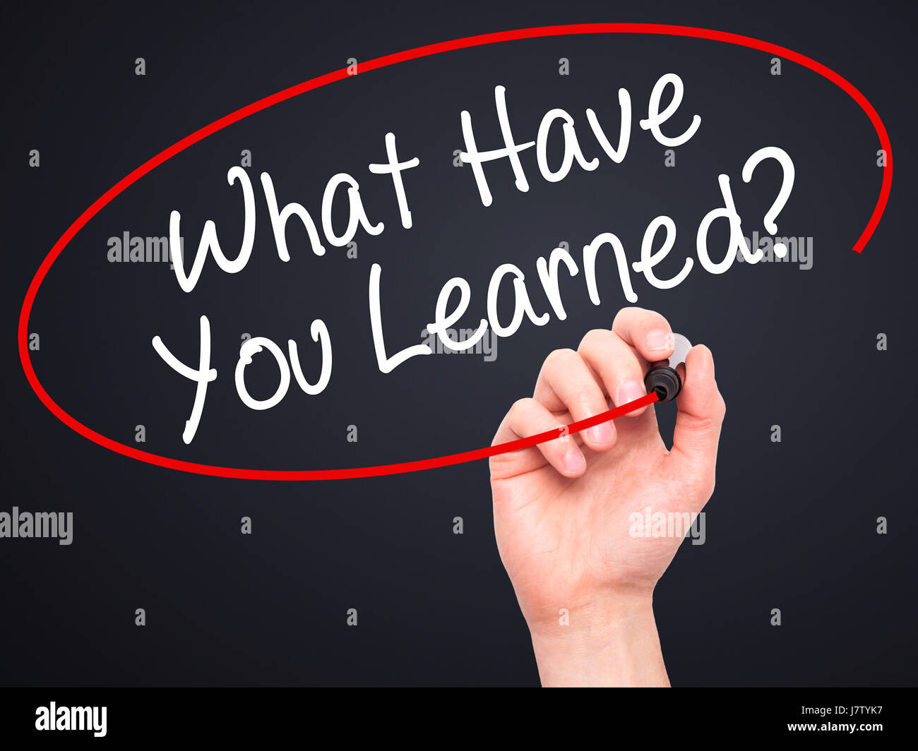 Man Hand writing What Have You Learned? with black marker on visual ...