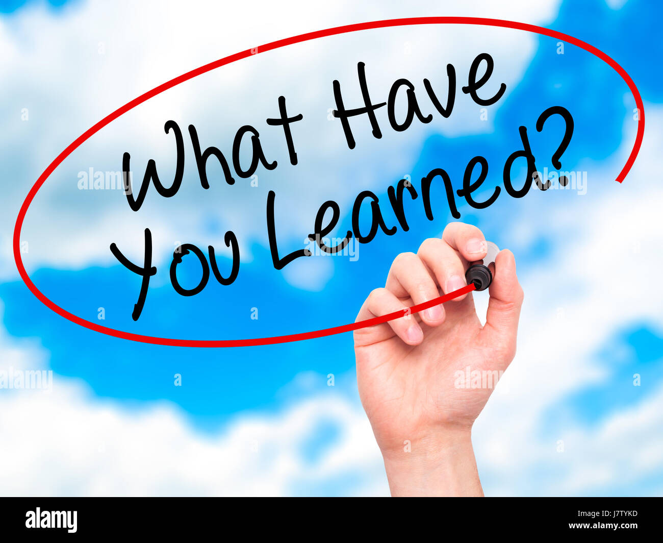 Man Hand writing What Have You Learned? with black marker on visual ...