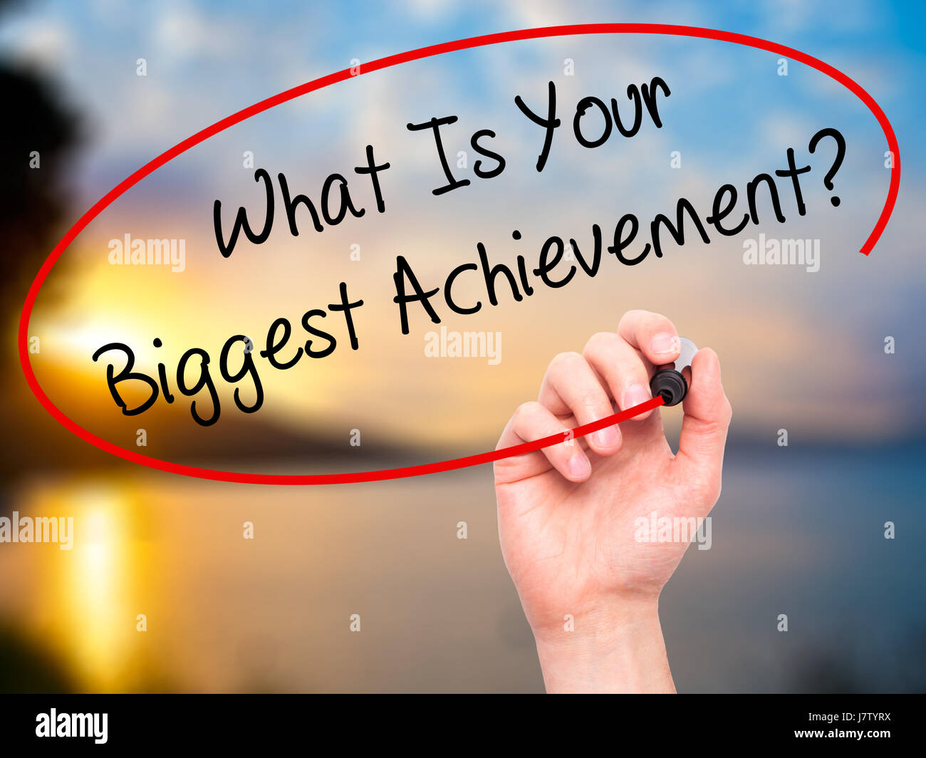 Man Hand writing What Is Your Biggest Achievement? with black marker on ...