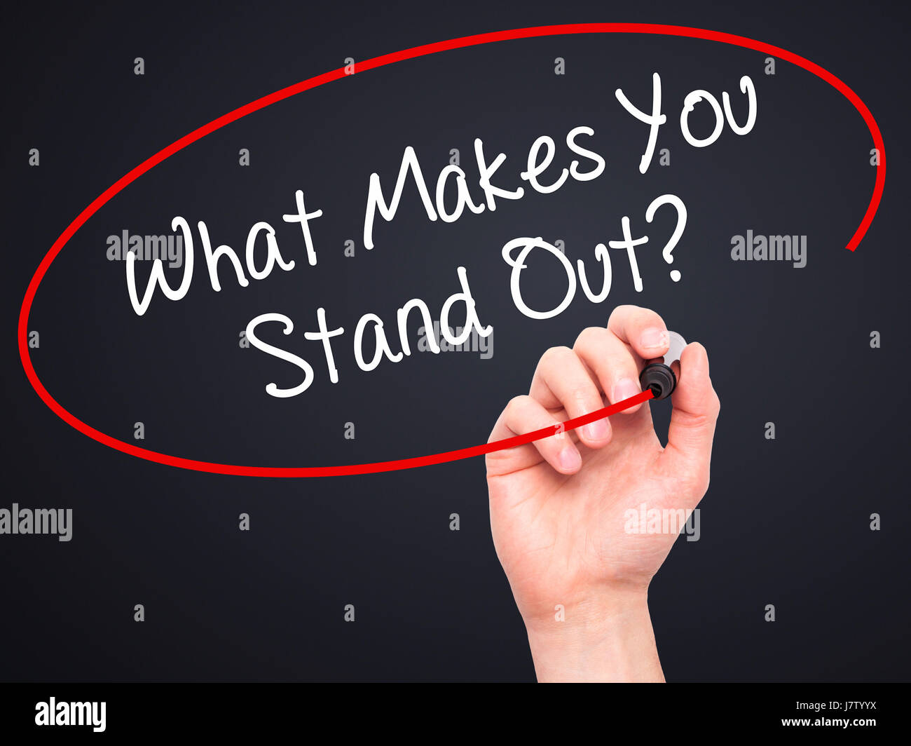 Man Hand writing What Makes You Stand Out? with black marker on visual ...