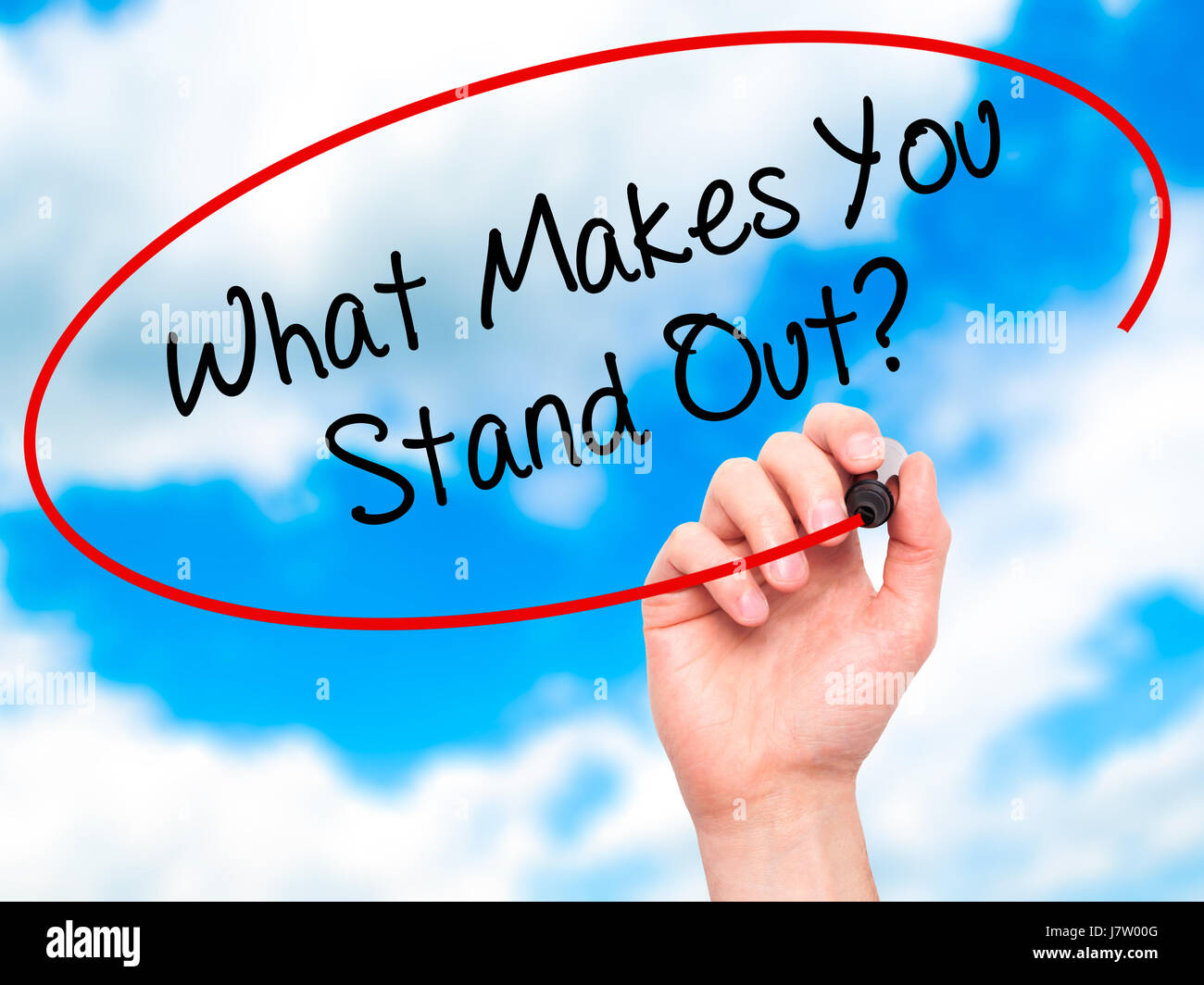 Man Hand writing What Makes You Stand Out? with black marker on visual ...