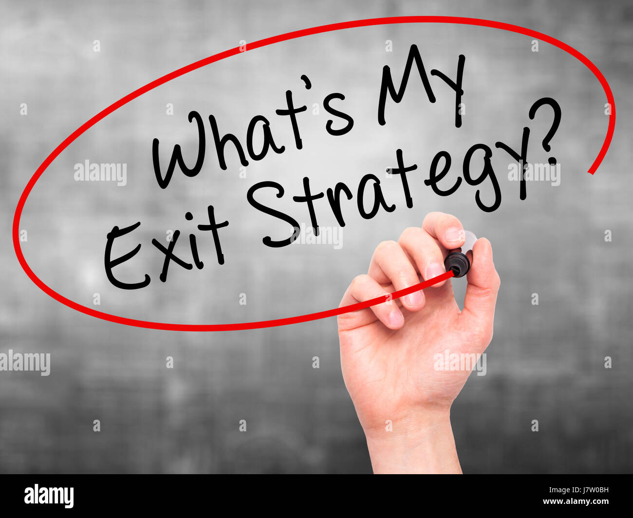 Man Hand writing What's My Exit Strategy? with black marker on visual ...