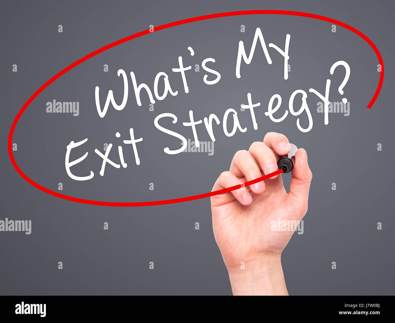 Man Hand writing What's My Exit Strategy? with black marker on visual ...
