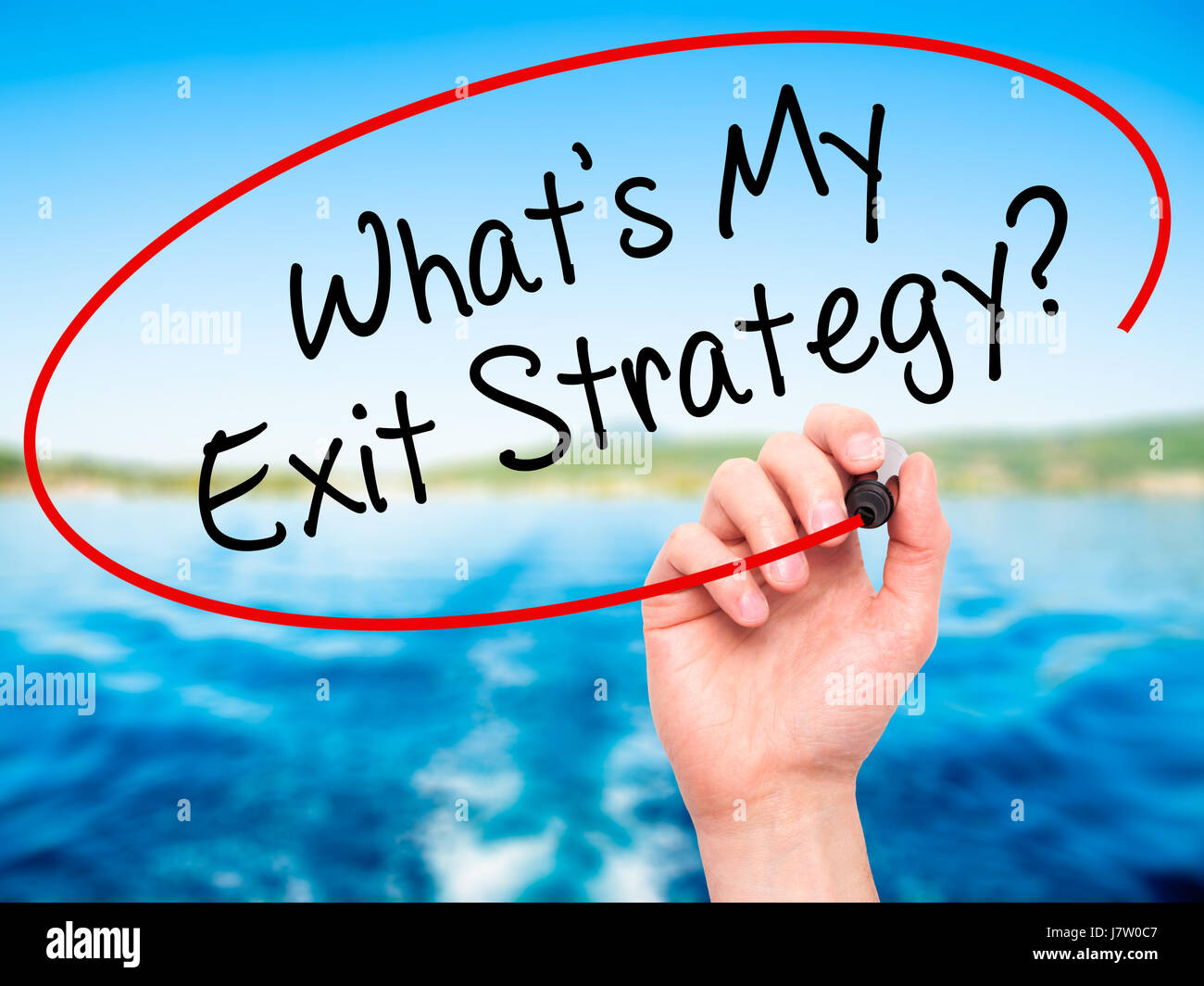 Man Hand writing What's My Exit Strategy? with black marker on visual ...