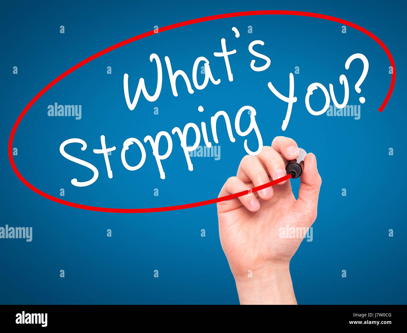 Man Hand writing What's Stopping You? with black marker on visual ...