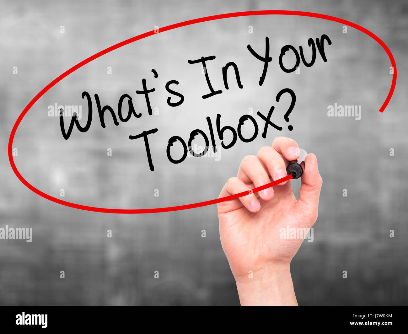 Man Hand writing What's In Your Toolbox? with black marker on visual ...