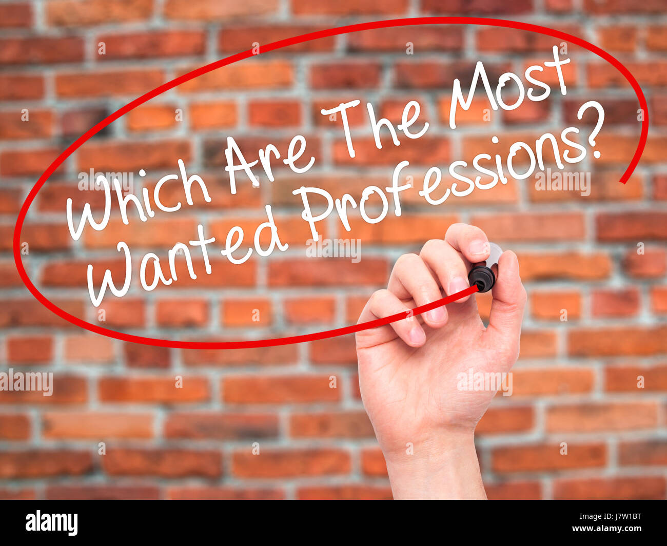 Man Hand writing Which Are The Most Wanted Professions? with black ...