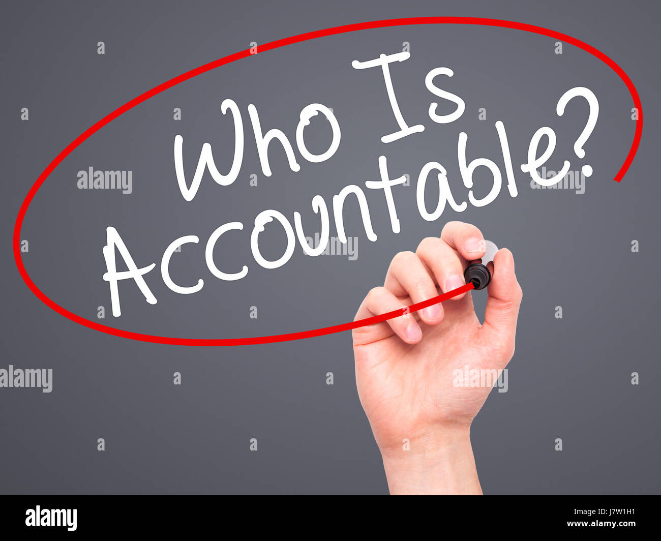 Man Hand writing Who Is Accountable? with black marker on visual screen ...