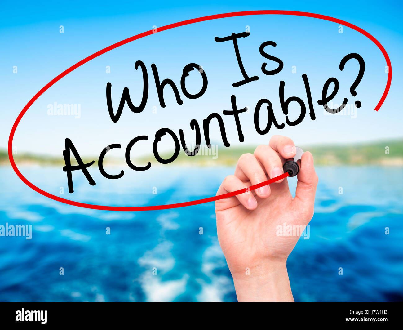Man Hand writing Who Is Accountable? with black marker on visual screen ...