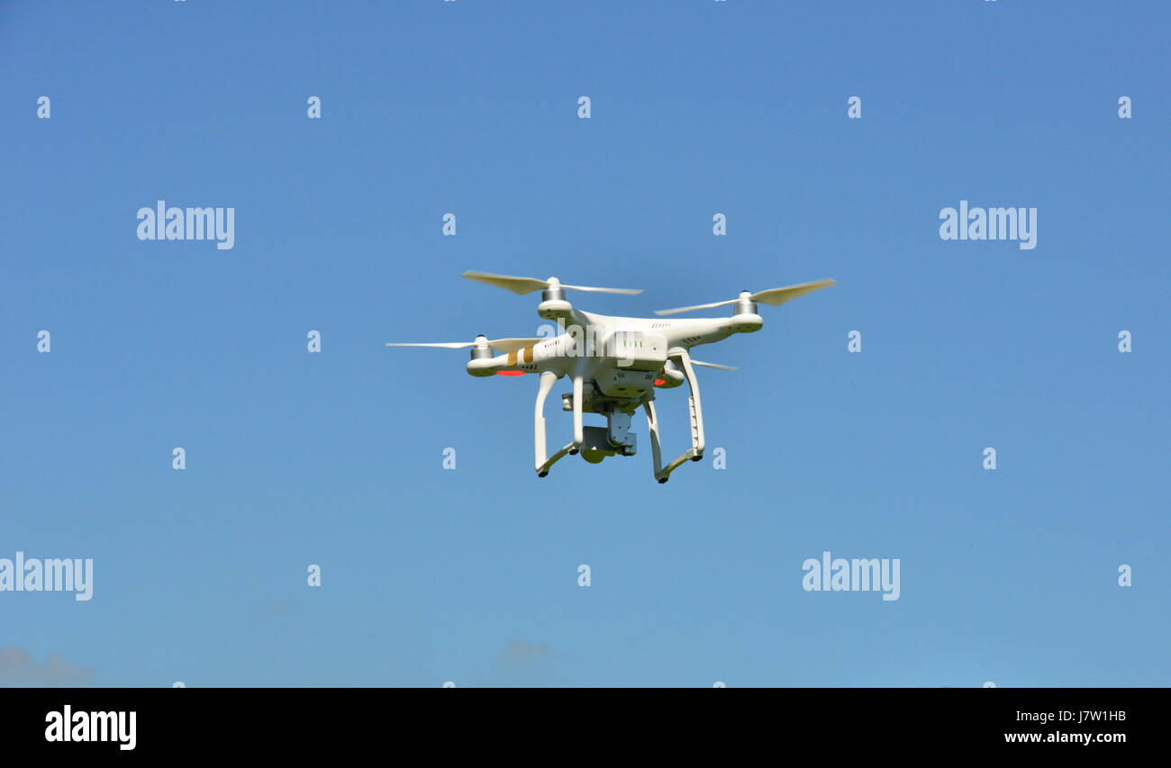 A surveillance drone flying and watching Stock Photo - Alamy