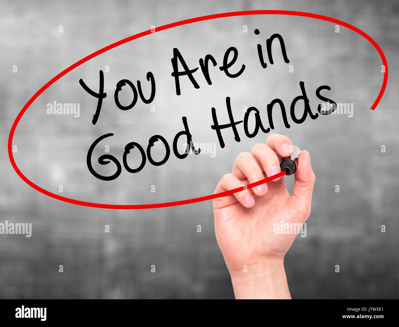 Man Hand writing You Are in Good Hands with black marker on visual ...