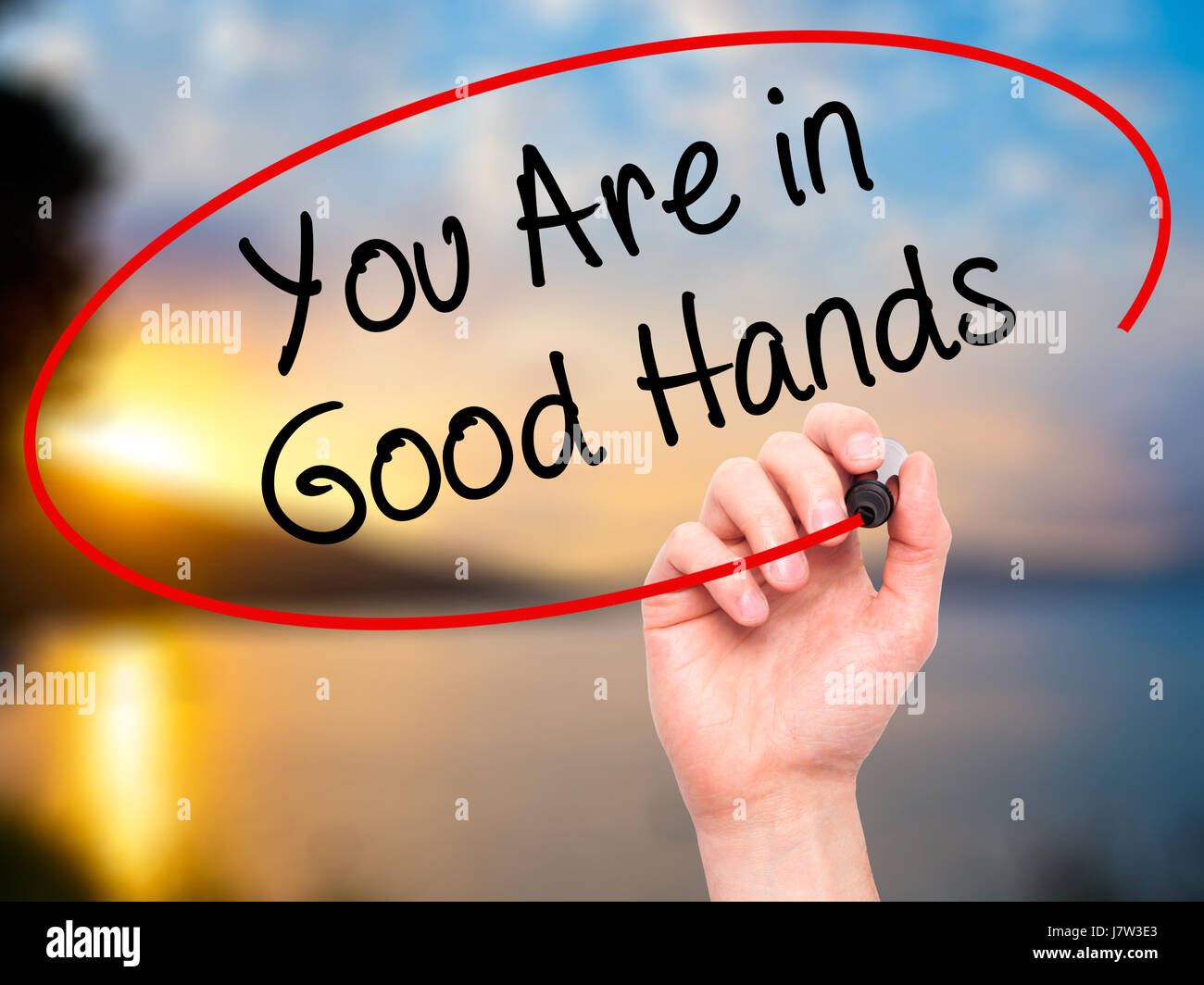 Man Hand writing You Are in Good Hands with black marker on visual ...