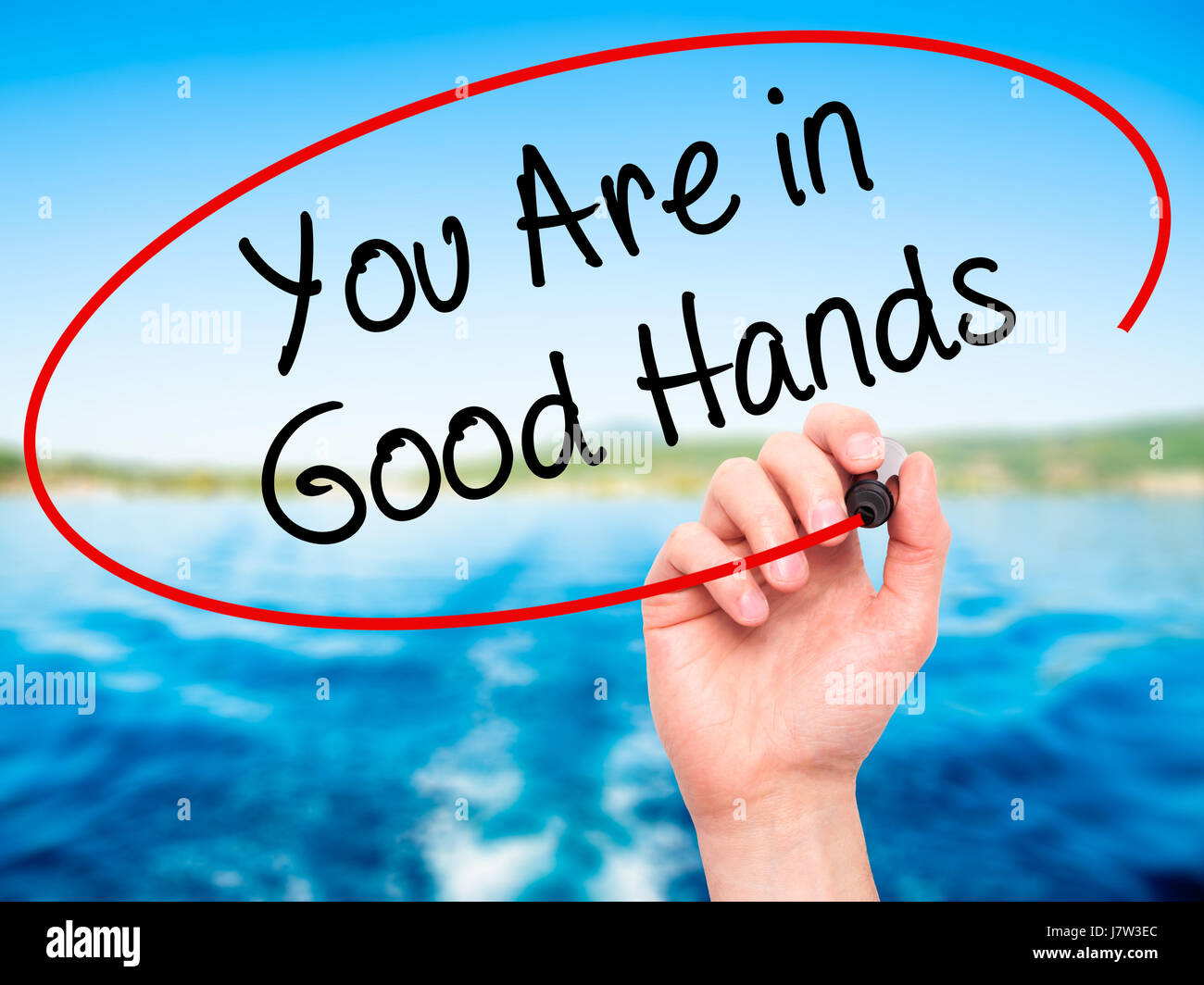 Man Hand writing You Are in Good Hands with black marker on visual ...