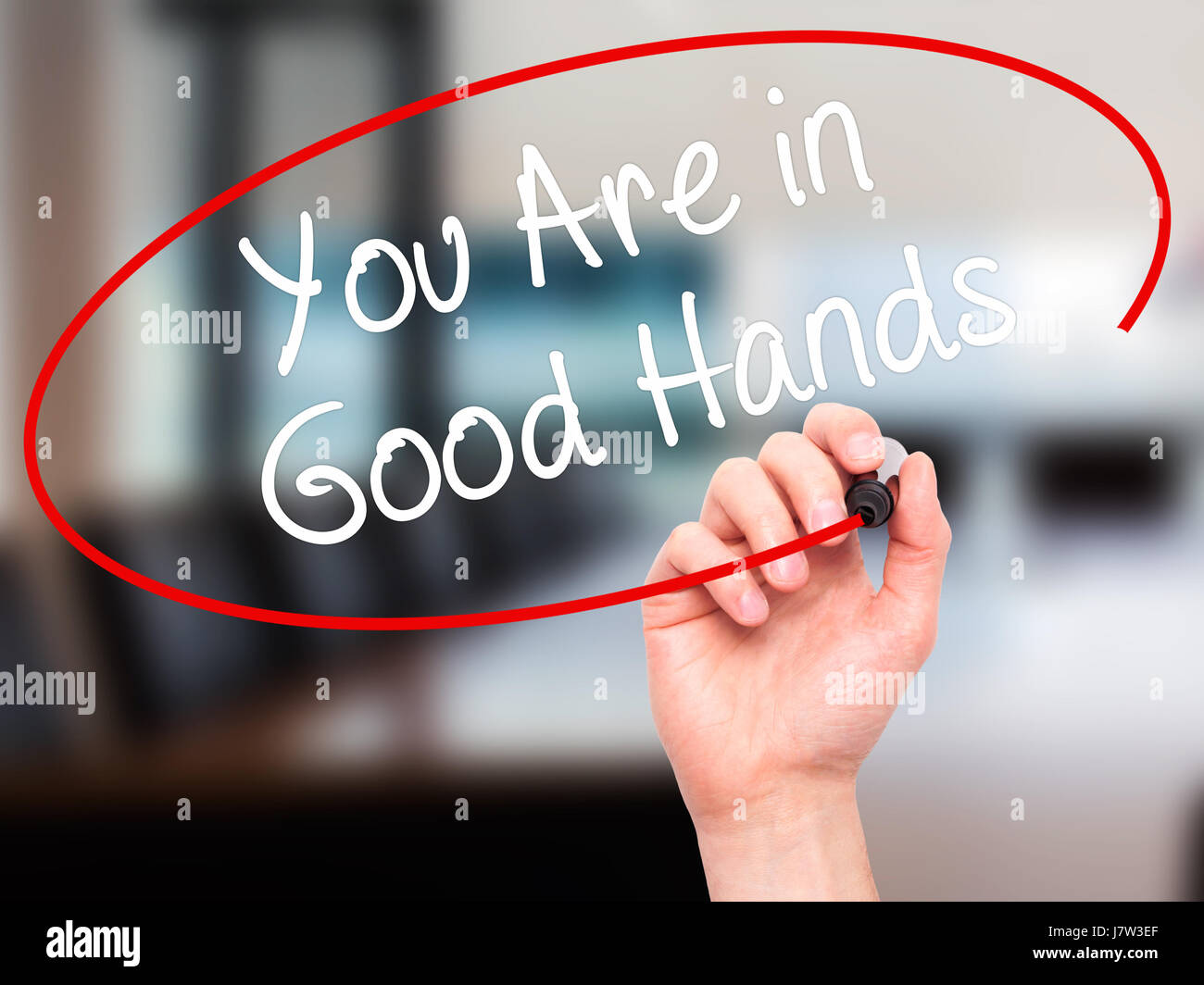 Man Hand writing You Are in Good Hands with black marker on visual ...