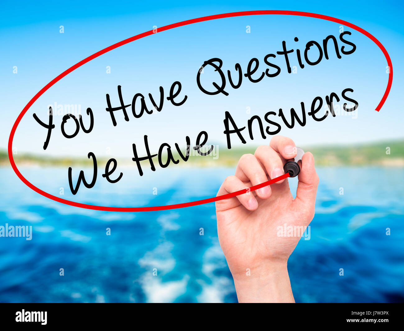 Man Hand writing You Have Questions We Have Answers with black marker ...