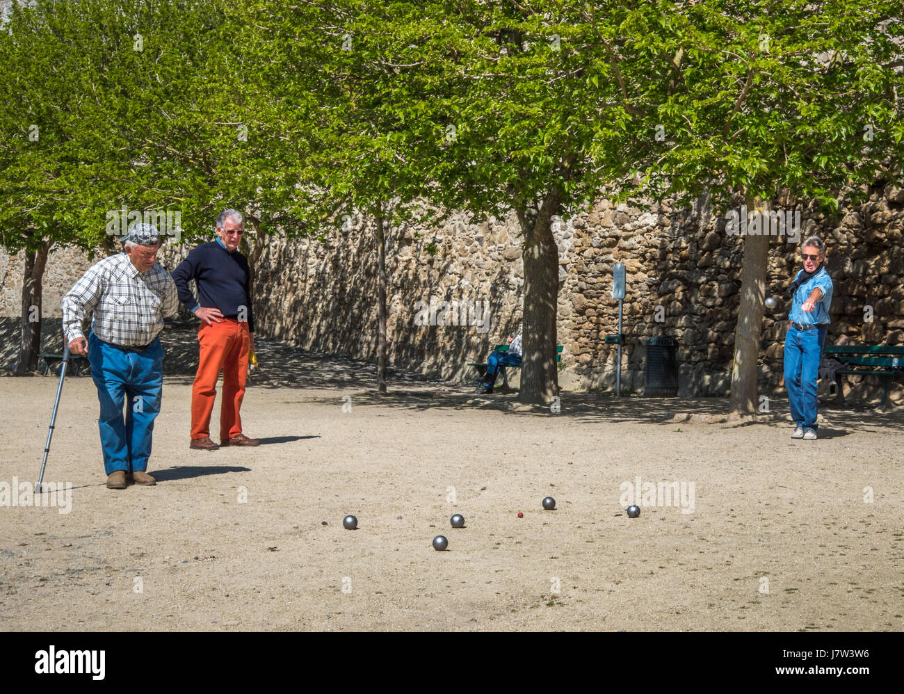 Men playing boules in shadow of ramparts of Saint Malo, Brittany France ...