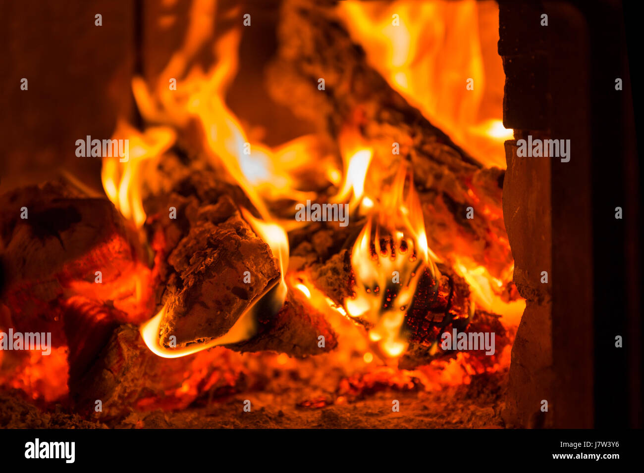 Fire and coals in brick fireplace furnace Stock Photo - Alamy