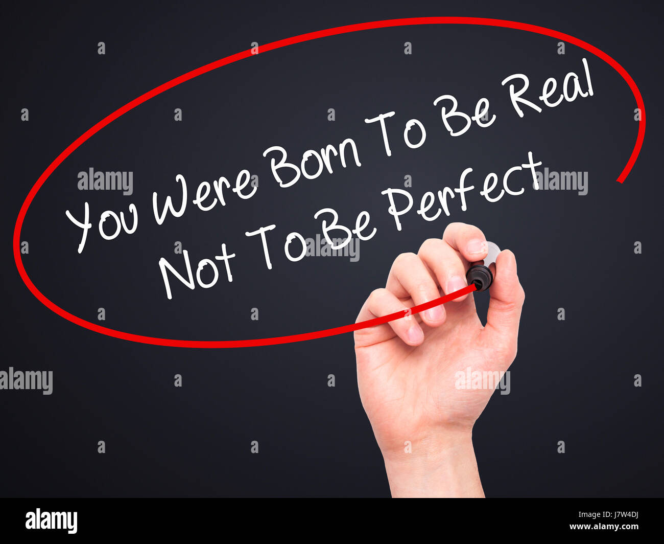 Man Hand writing You Were Born To Be Real Not To Be Perfect with black ...
