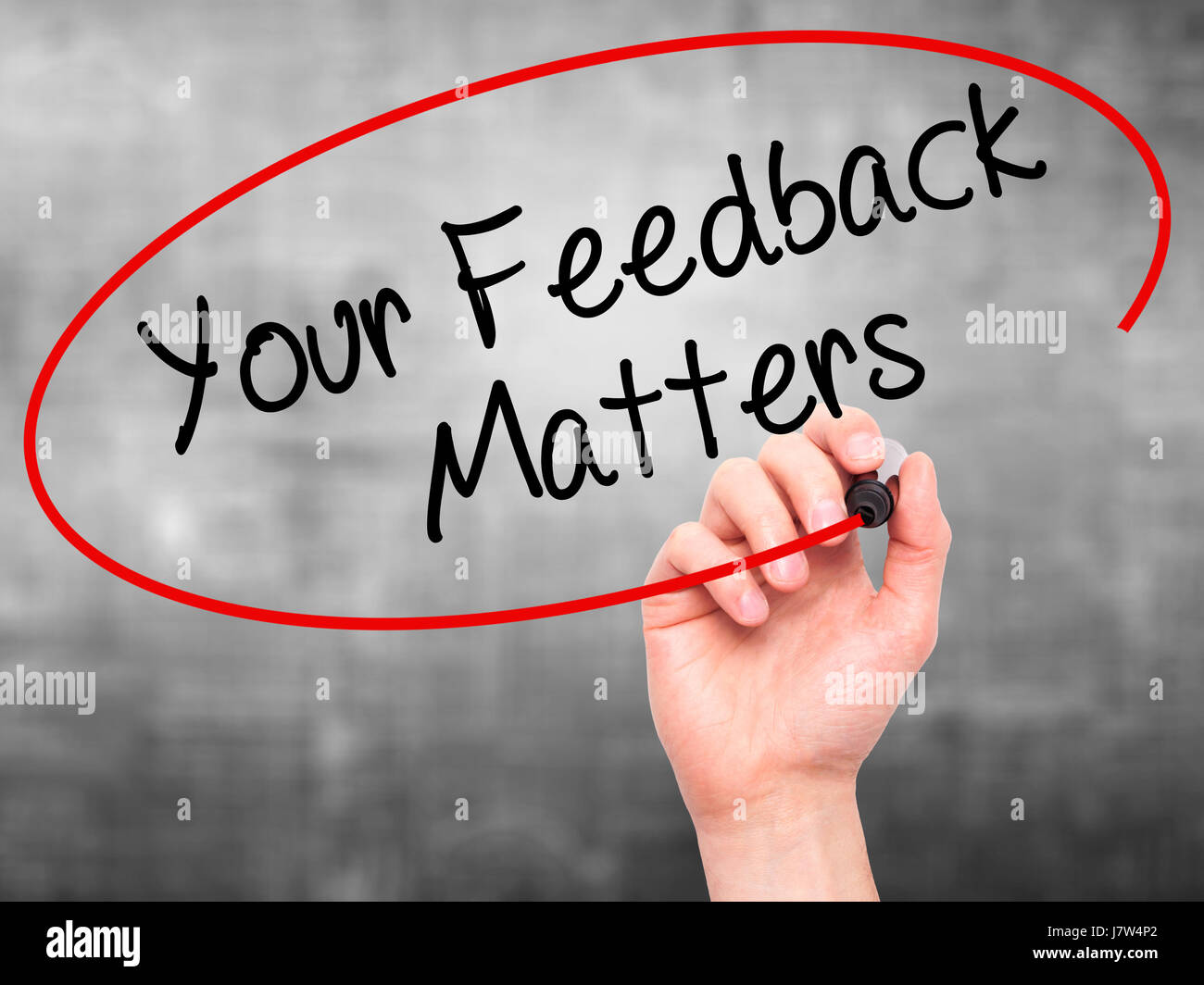 Man Hand writing Your Feedback Matters with black marker on visual ...