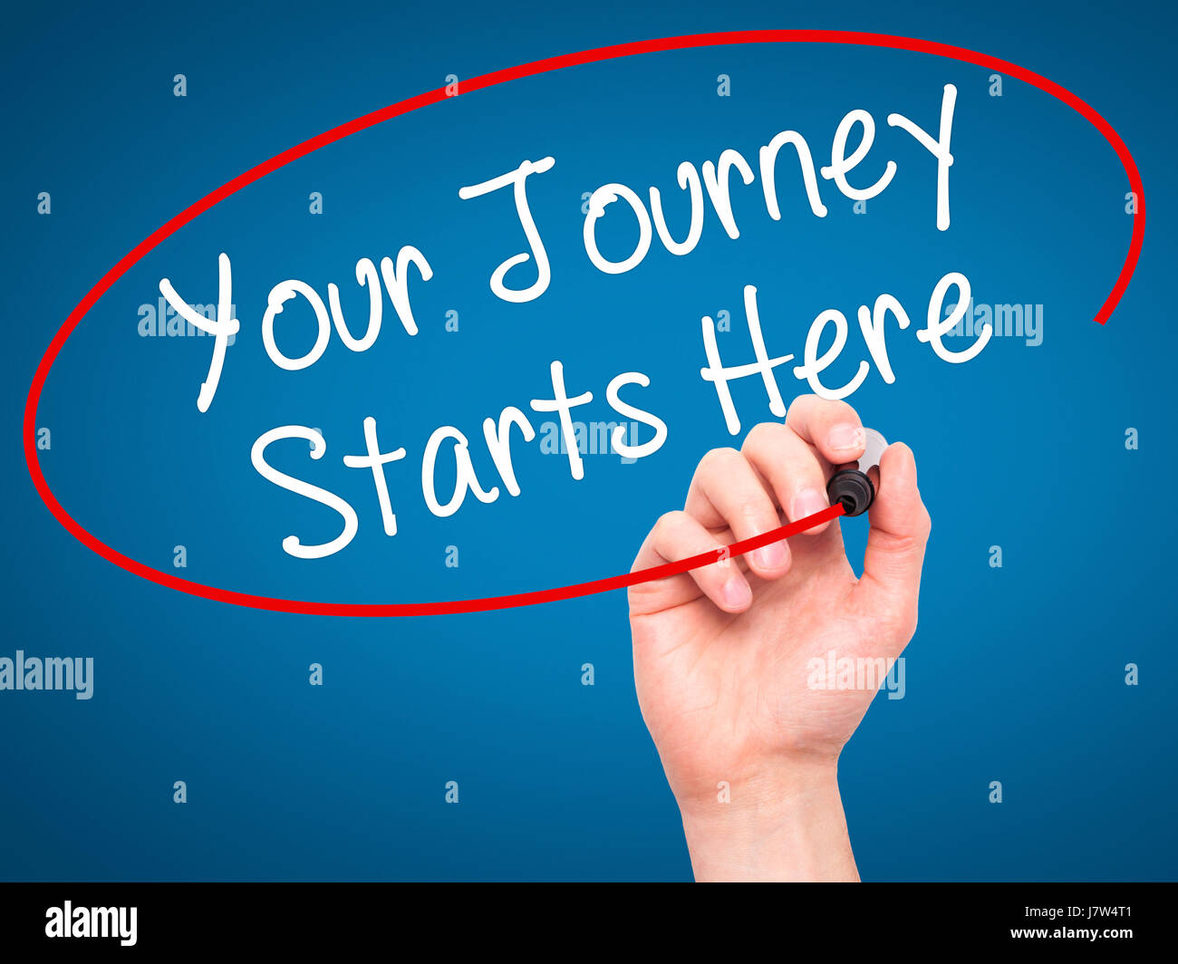 Man Hand writing Your Journey Starts Here with black marker on visual ...