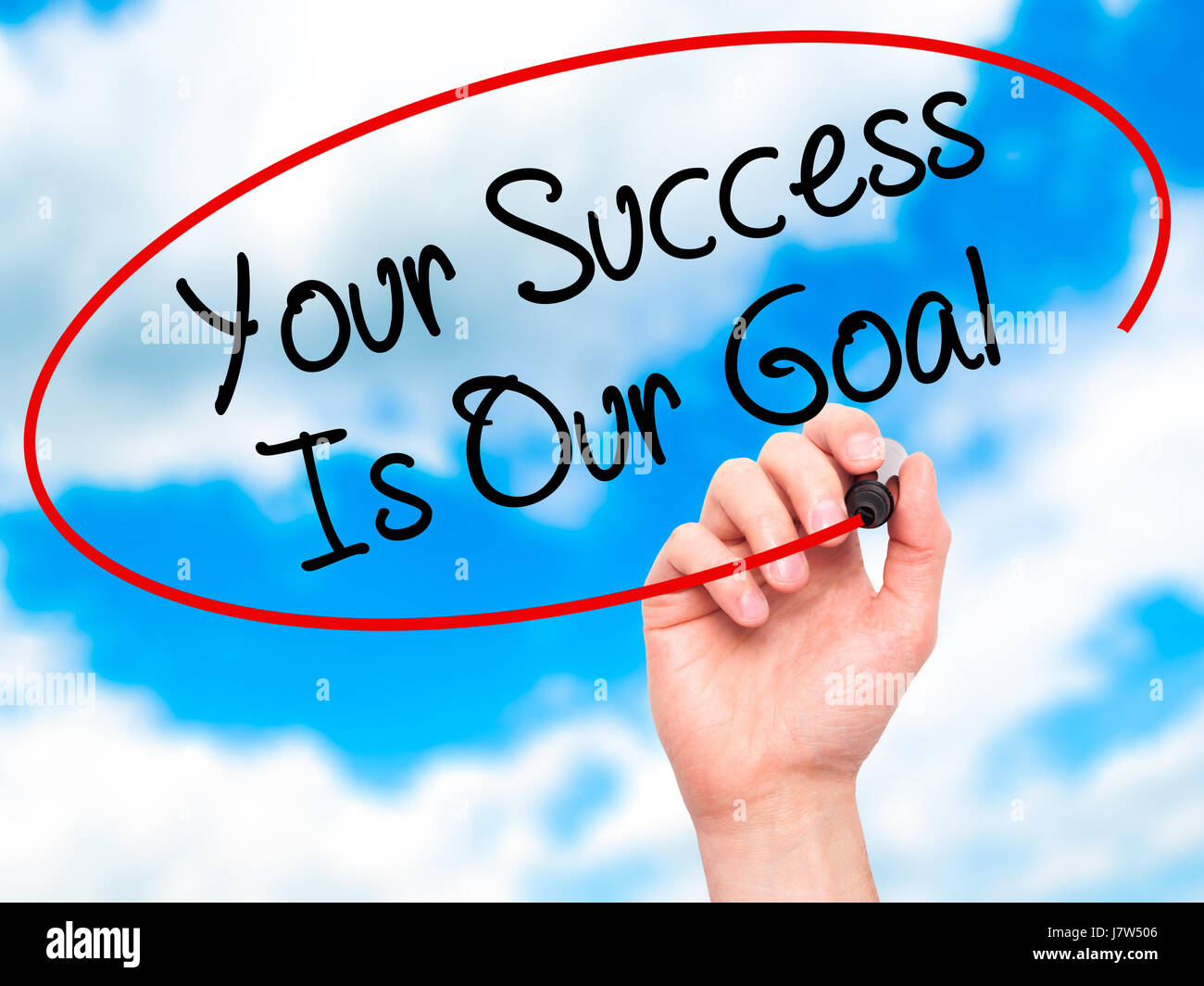 Man Hand writing Your Success Is Our Goal with black marker on visual ...